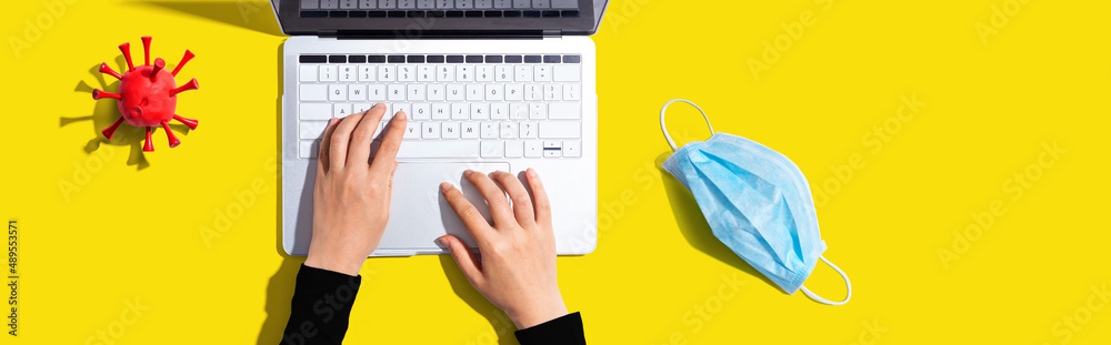 Laptop computer with a facial mask - overhead view Stock Photo | Adobe ...