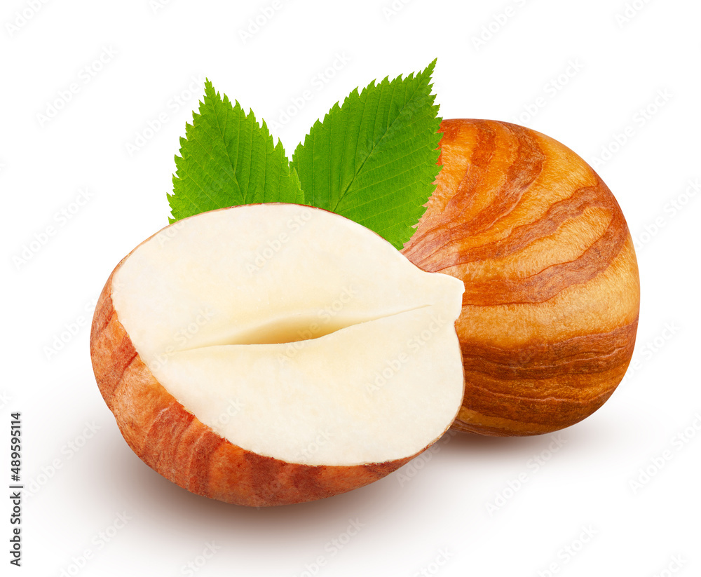 Foto de One whole and one cut peeled hazelnuts with leaves isolated on ...
