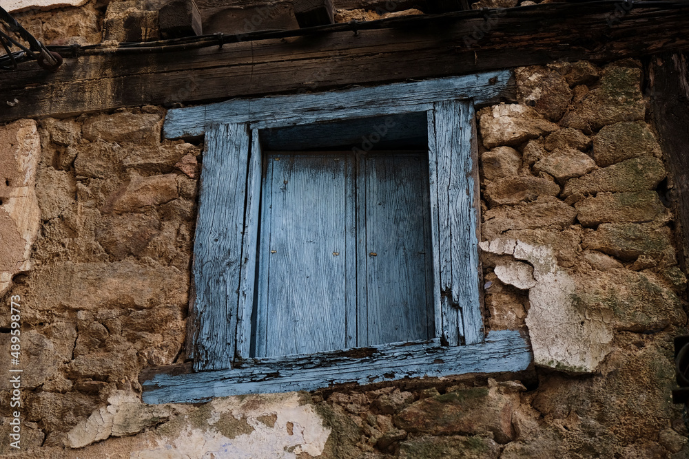 Blue painted wooden window in a stone house Stock Photo | Adobe Stock