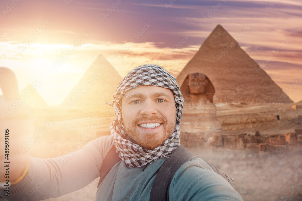 Travel Selfie photo man in hat background pyramid of Egyptian Giza and ...
