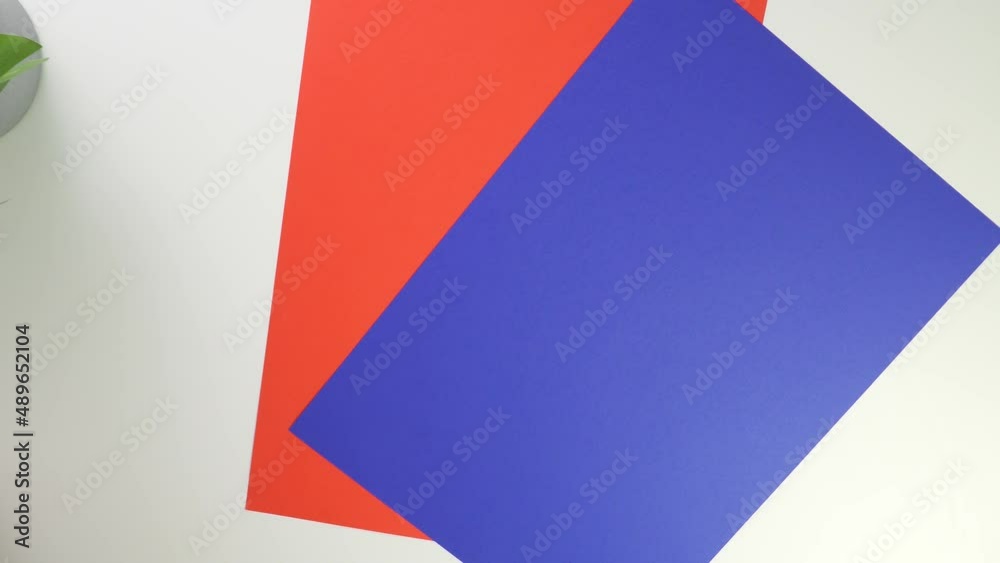 Put red and blue sheet of paper on white table craft. prepare desktop ...
