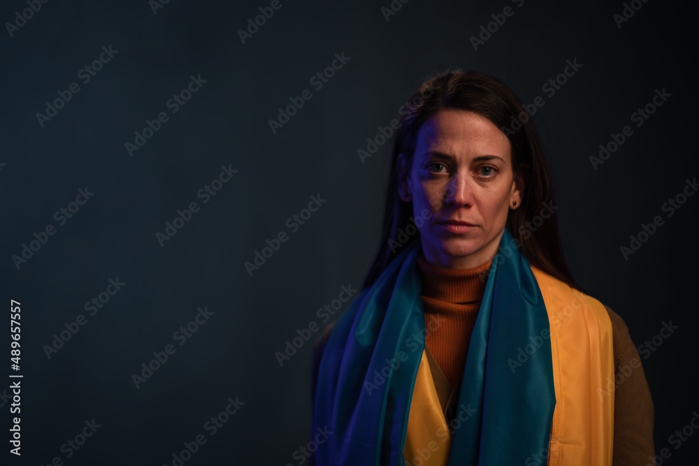Sad woman covered with Ukraine flag. Concept of standing with Ukrainian ...