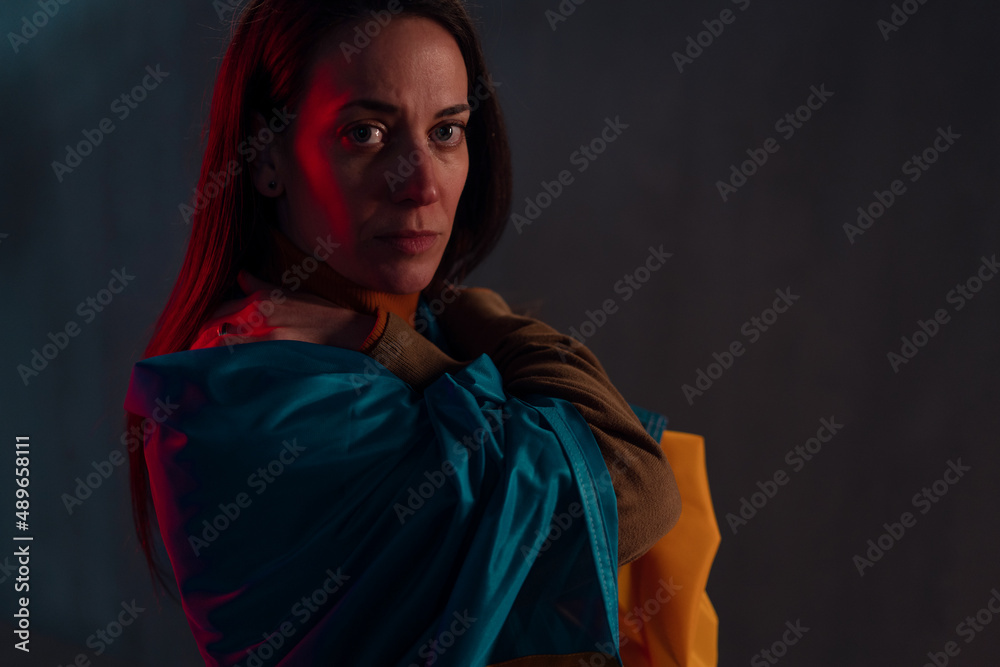 Sad woman covered with Ukraine flag. Concept of standing with Ukrainian ...