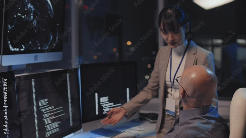 Tilting down of young Asian female manager wearing formal attire ...