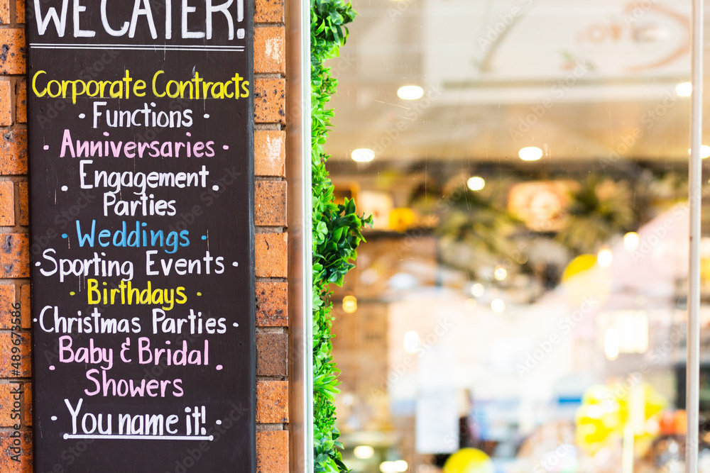 We cater for events sign for catering outside coffee shop window Stock ...
