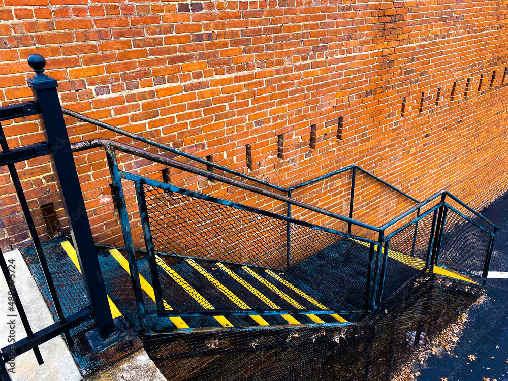 city industrial fire escape emergency exit stairway metal iron caution ...