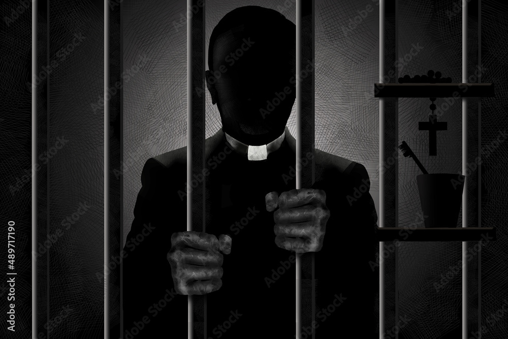 A Catholic priest identified by his clergyman collar is seen in ...