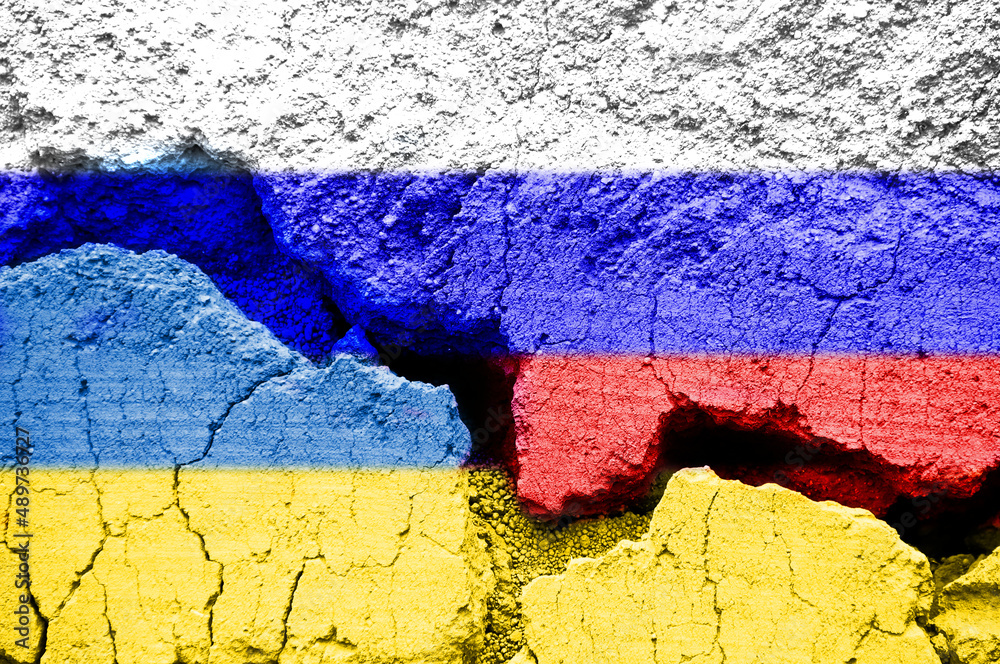 Russian and Ukrainian flag on cracked ground background. Ukraine Russia ...