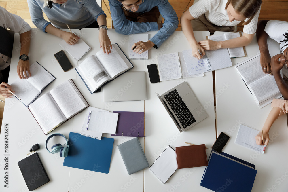 Above top view concentrated happy multiracial diverse team of young ...