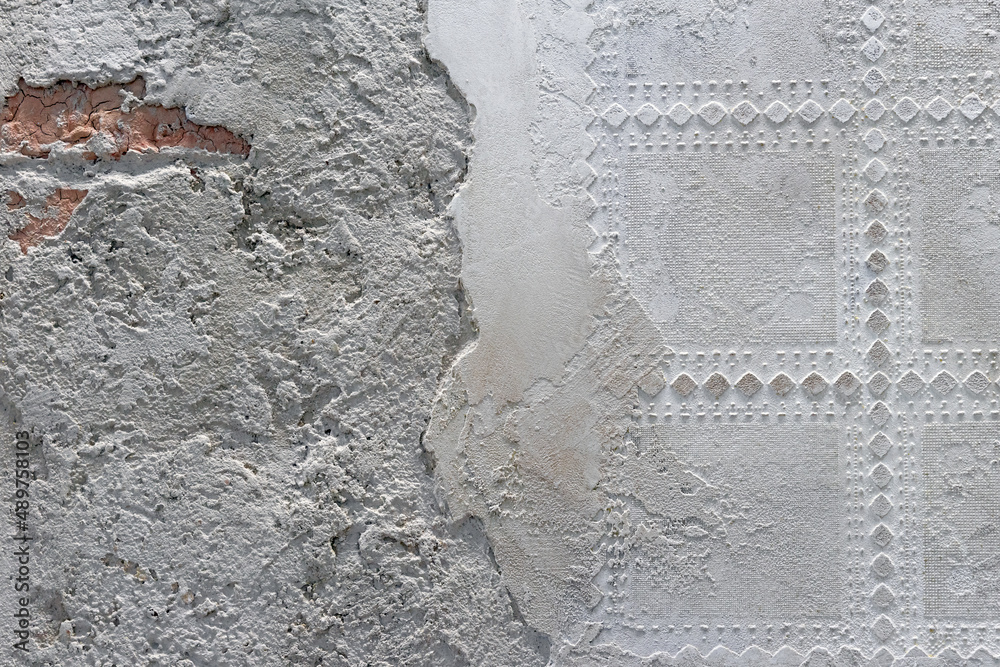 Damaged plaster on brick wall background. Brickwork under crumbling ...