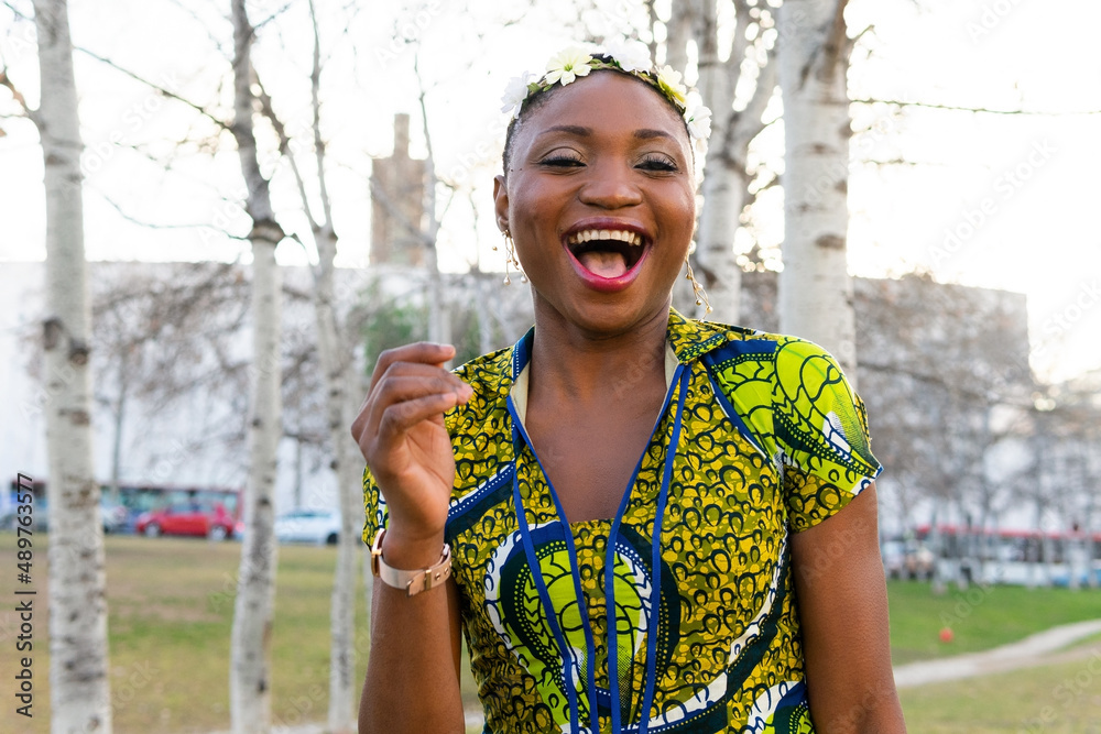 African female laughing in park Stock Photo | Adobe Stock