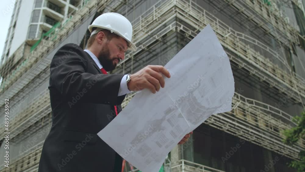 Construction site there is a civil engineer,designer, according to the ...