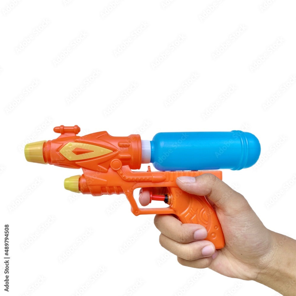Hand holding plastic watergun toy with vibrant color of 90s on isolated ...