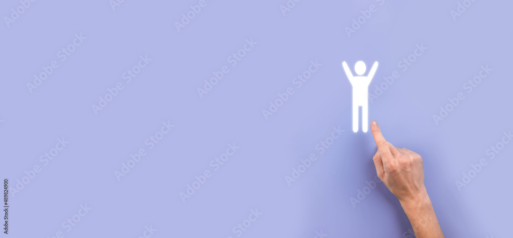 Male hand holding human icon on grey background. Human Resources HR ...