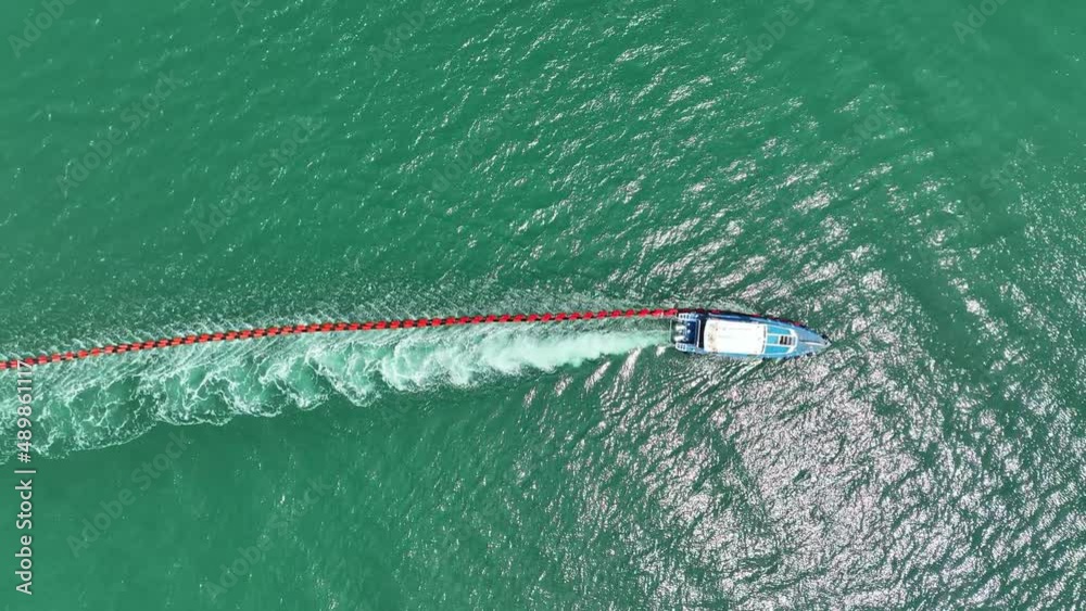 Sea float Buoyancy or spar buoy was dragged by speed boat sailing on ...