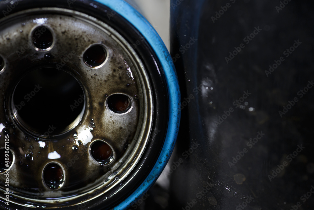 Car oil filter is very dirty and oil stains background.engine oil stain ...