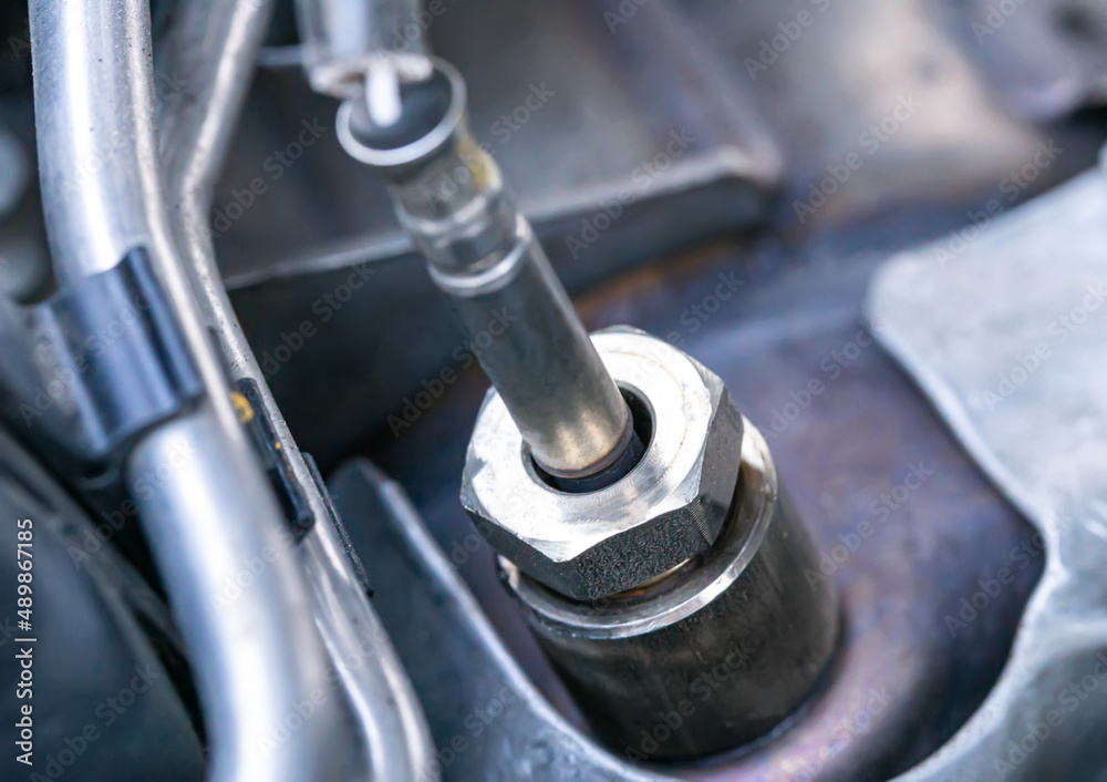Automotive sensor lambda probe in a diesel engine. Measuring oxygen content in car exhaust gases ...