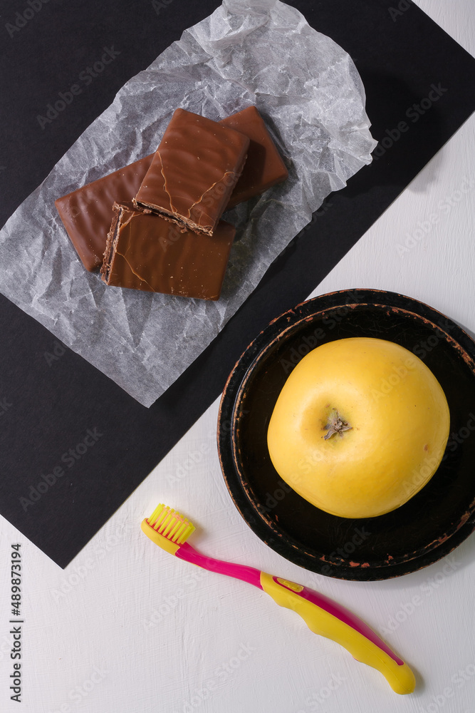 Caries prevention, teeth health. Fresh fruit, apple against unhealthy ...