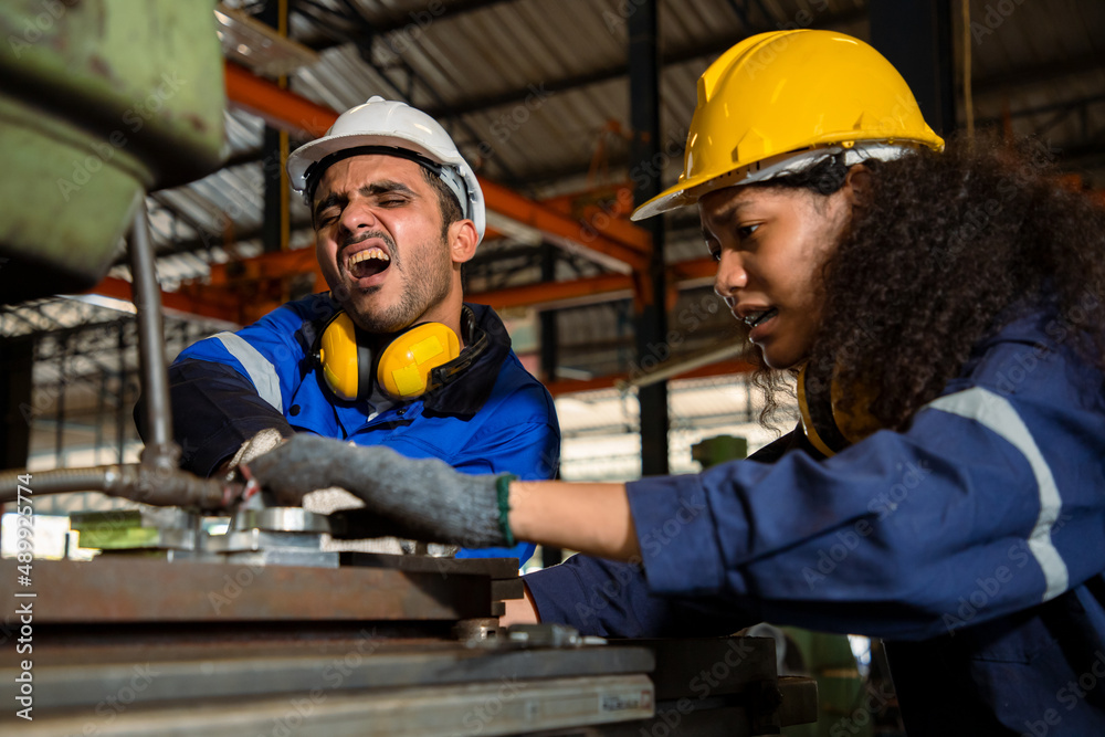 Engineer men wearing uniform accident on machines from work in lathe ...