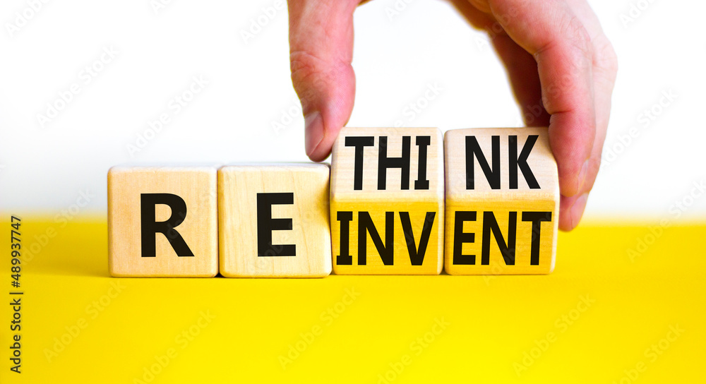 Reinvent and rethink symbol. Businessman turns cubes and changes the ...