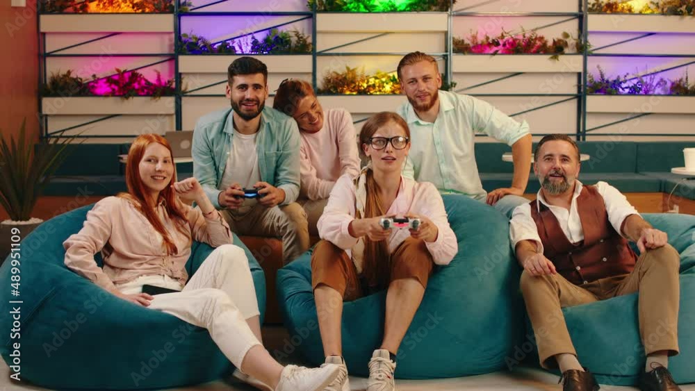 Six people are in a very homey comfortable atmospheric room and they ...