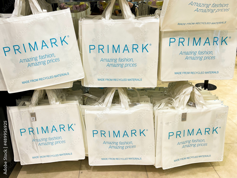 London, England - June 2020: Rack in a Primark shop holding plastic ...