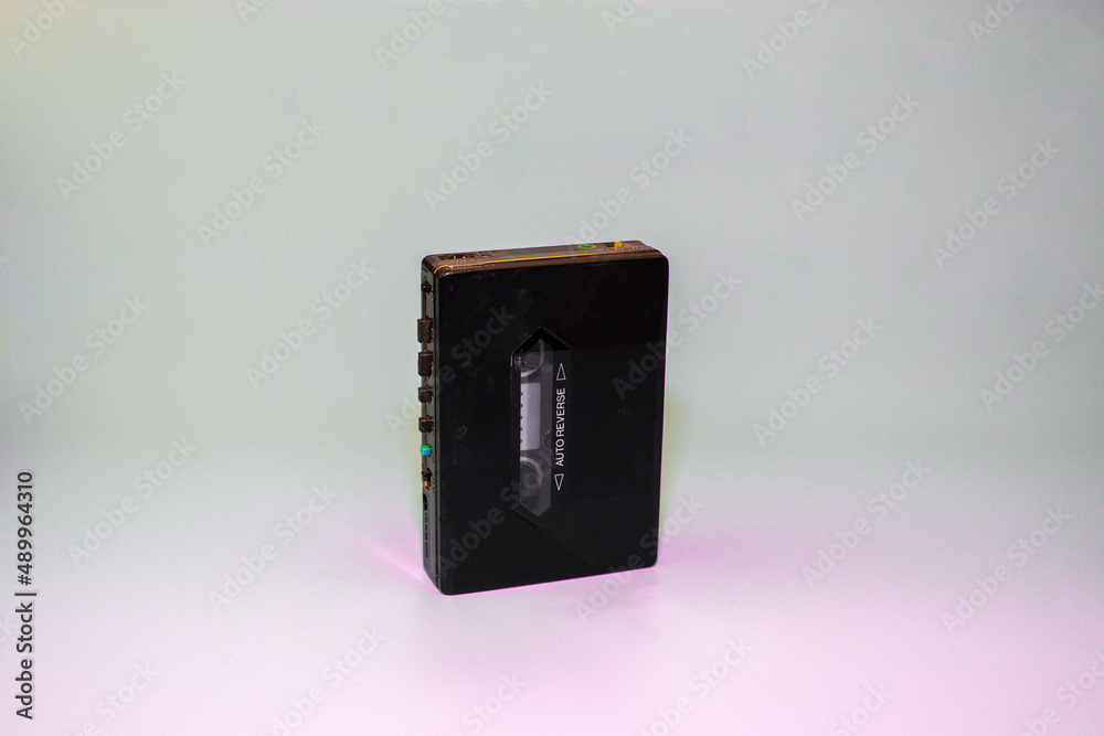 Vintage portable cassette player from the 70s on a pink and green ...