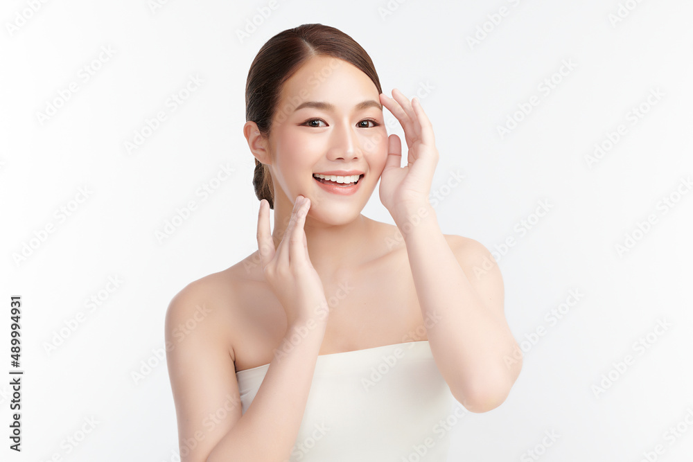 Beautiful young asian woman with clean fresh skin on white background ...