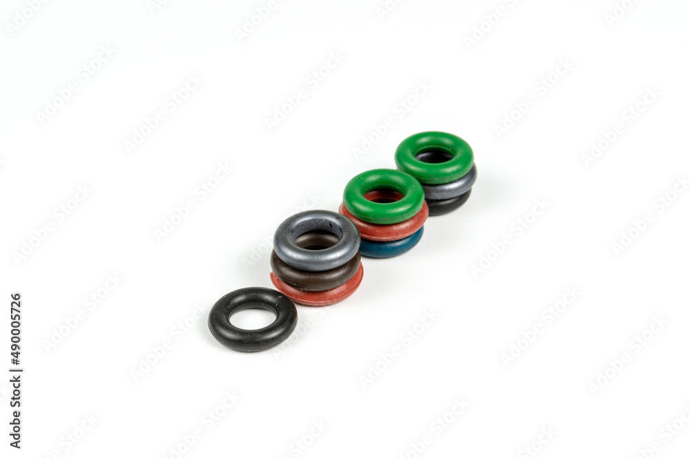 Hydraulic and pneumatic o-rings in black in different sizes on a white ...