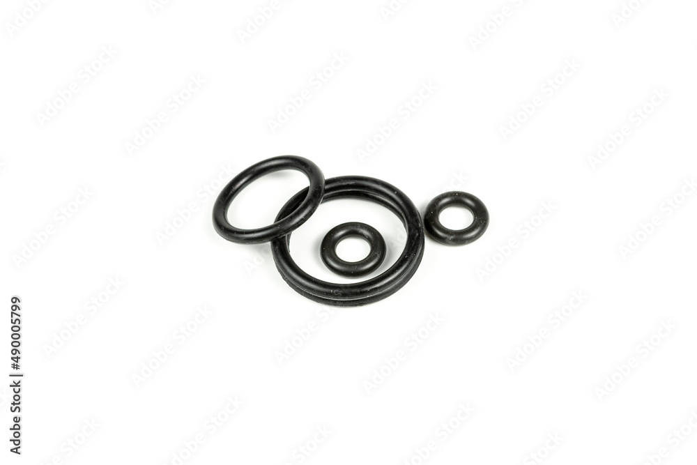 Hydraulic and pneumatic o-rings in black in different sizes on a white ...