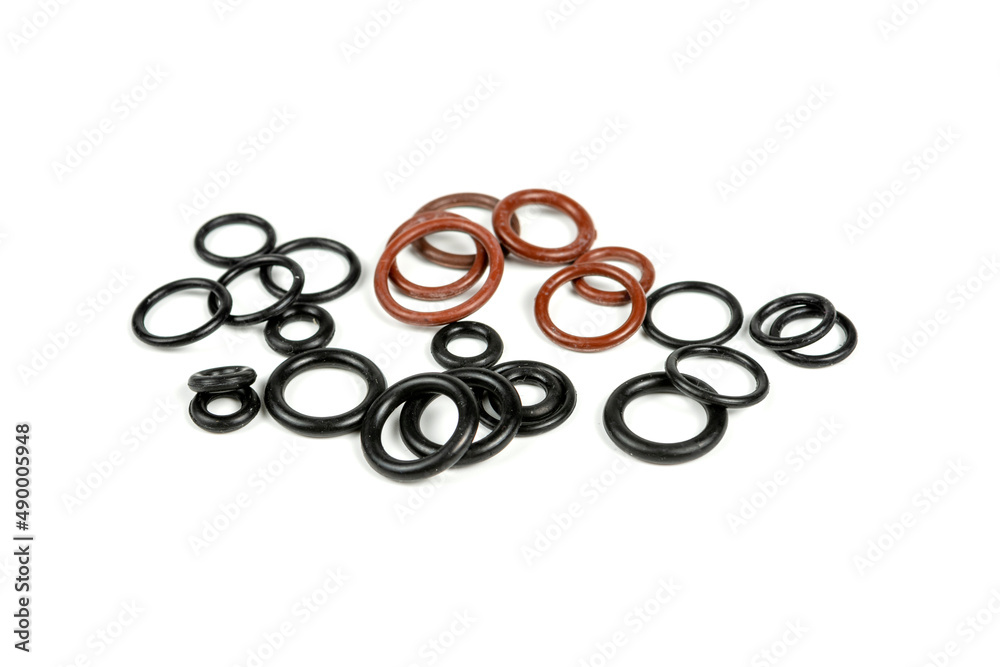 Hydraulic and pneumatic o-rings in black in different sizes on a white ...