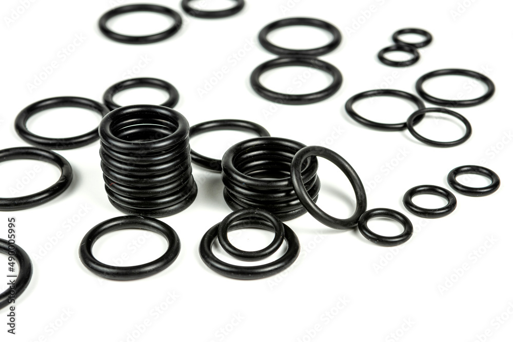 Hydraulic and pneumatic o-rings in black in different sizes on a white ...