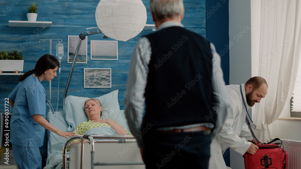 Worried man calling for medical assistance while woman breathing heavy ...