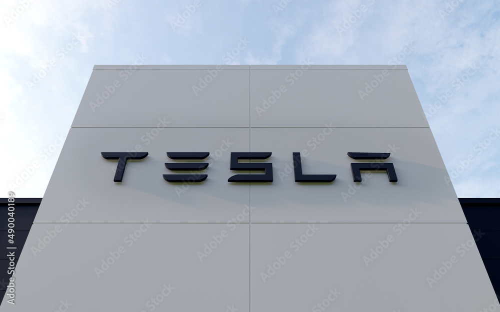 Tesla logo on a building at tesla dealership in Westmont Stock Photo ...