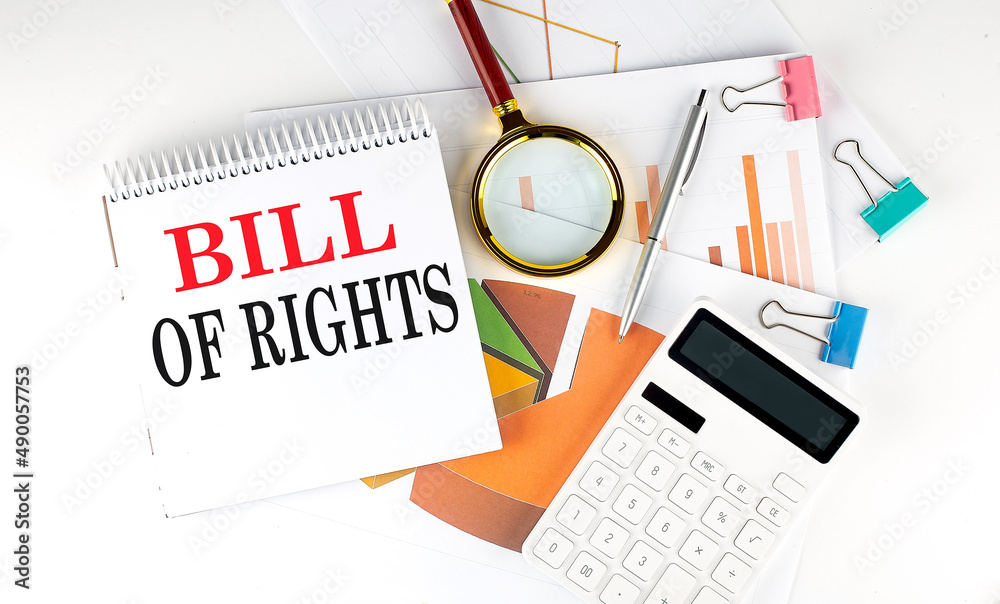 White notepad text BILL OF RIGHTS with diagram,chart,calculator on the ...