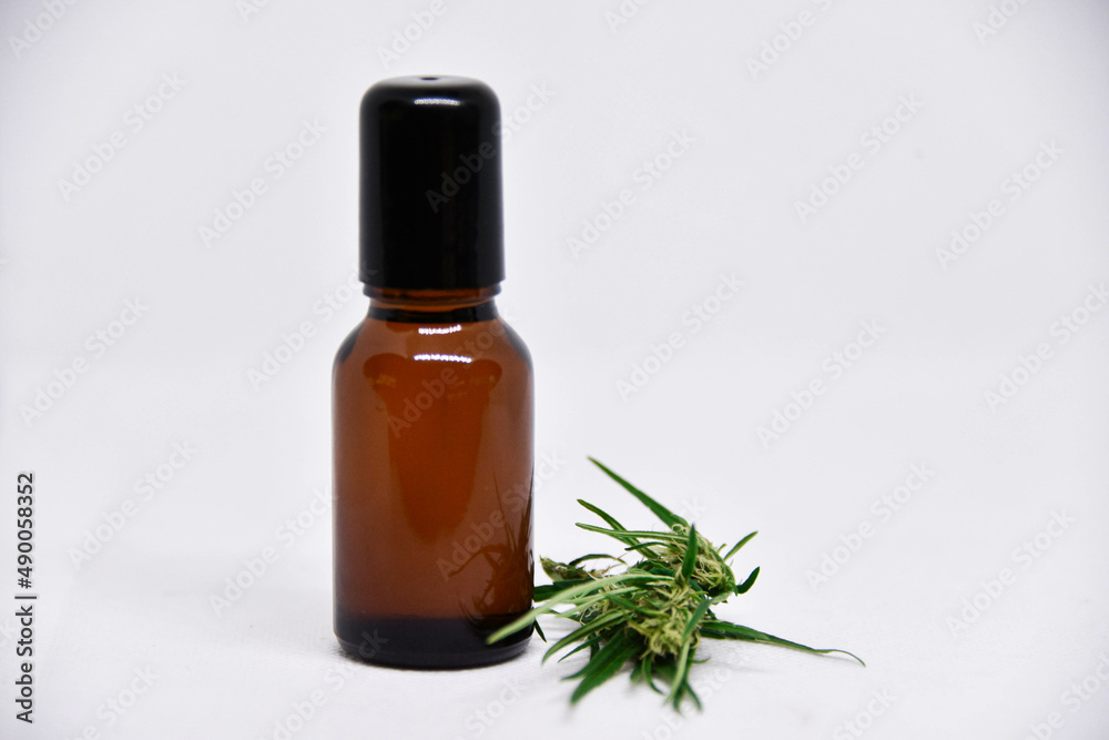 Cannabis plant leaves and cannabis extract oil in a bottle drug or ...