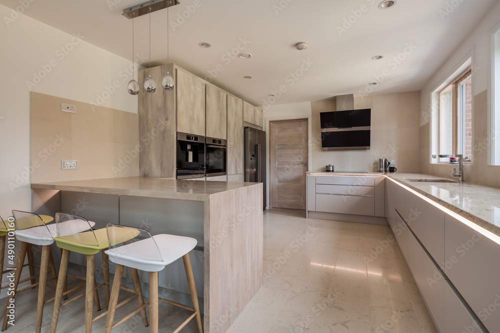 Contemporary modern kitchen with breakfast bar Stock Photo | Adobe Stock