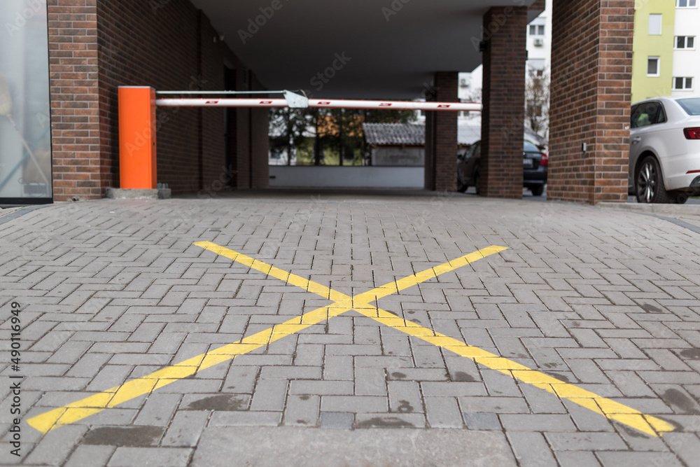 Cross sign and ramp in front of building garage Stock Photo | Adobe Stock