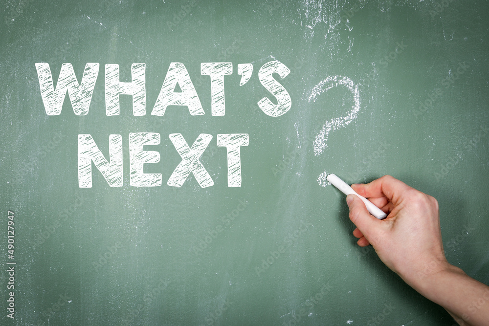What's next. Text with a question mark on a green chalkboard background ...