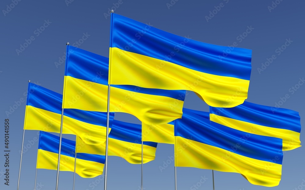 Many blue and yellow flags on flagpoles. Ukrainian flags on blue ...