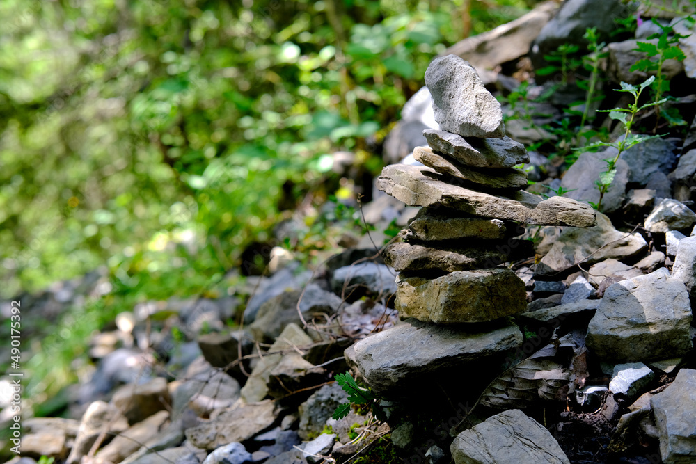 stack of pebbles in an unstable state, pyramid made of flat stones ...