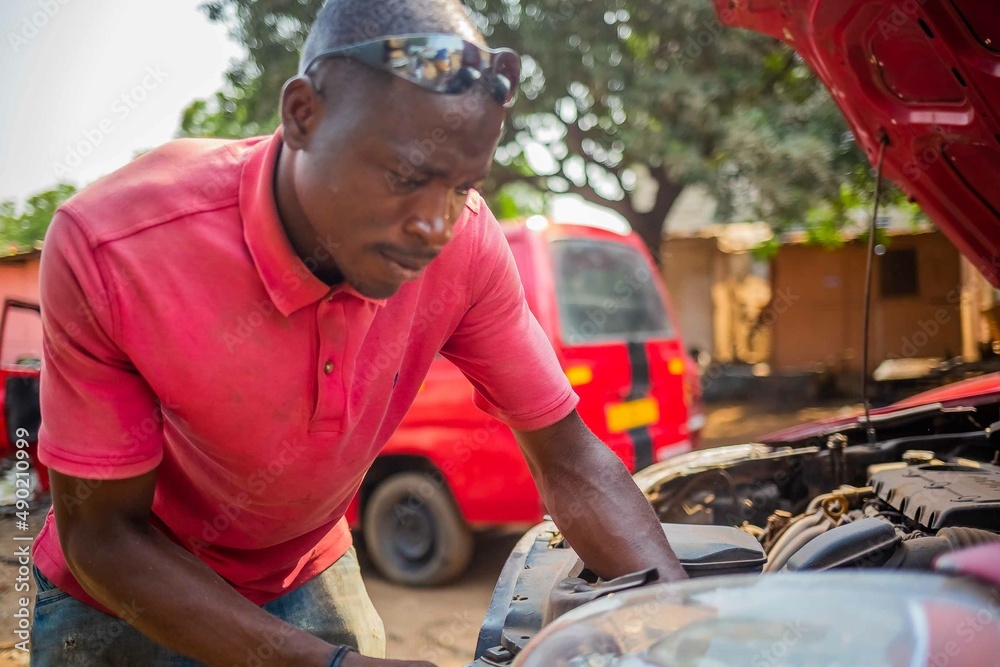 African Auto Bodyworks, Welding a Car in Africa, 2 African men working ...