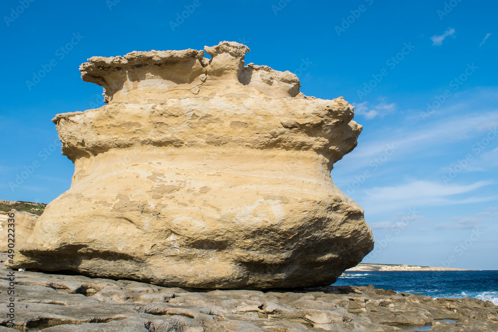 Large globigerina limestone on wave-cut platform along the coast of ...