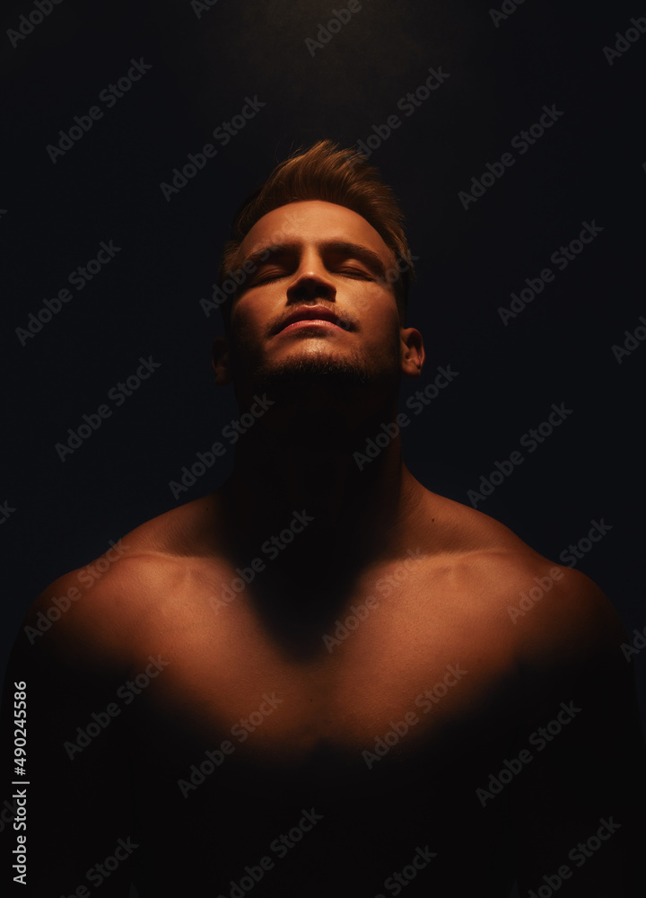 Being handsome wasnt much of a burden. Shot of a handsome young man ...