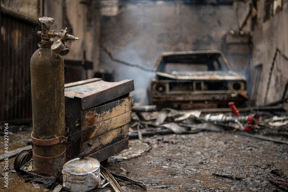 Close up photo of burned welding gas cylinder. Fire disaster. Explosion ...