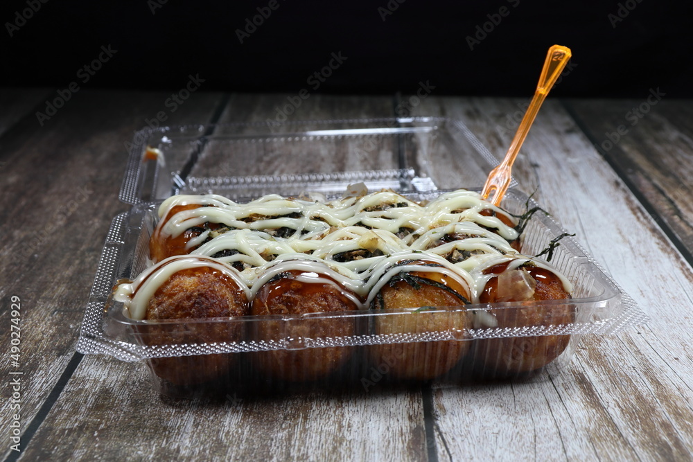 Pile of Takoyaki (Traditional Japanese octopus ball) dressing with ...
