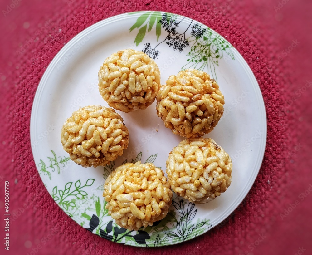 Indian Traditional Puffed Rice Balls is a sweet made using puffed rice ...