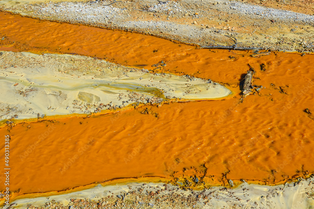 Orange river of poison from a gold mine - pollution disaster Stock ...