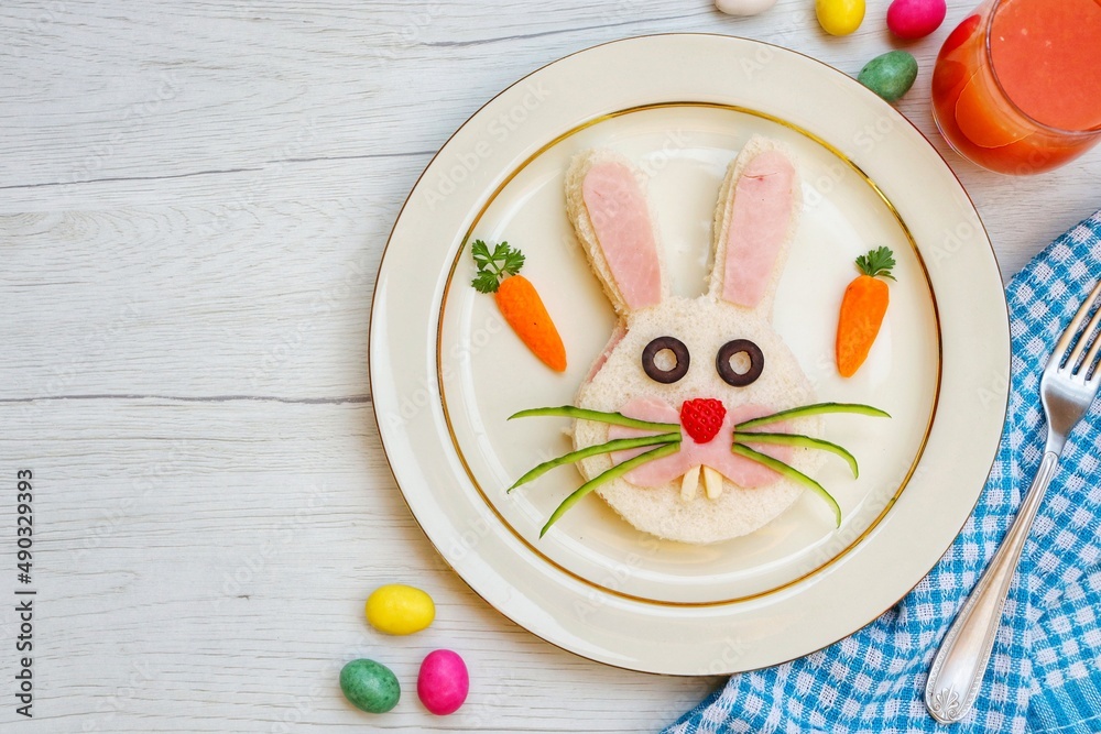 Easter bunny sandwiches made it from bread,ham,cucumbers,black olives ...