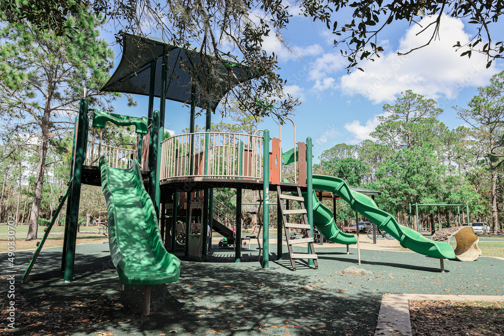 Child Playing In The Playground Of Moss Park In Orlando Florida Moss Child Playing In The Playground Of Moss Park In Orlando Florida Moss